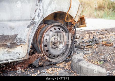 Minibus after a fire, burnt body and interior of the car. Burnt rusty ...
