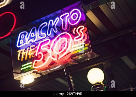 Vintage Neon Back to the 50s Sign in Rainy Restaurant Window Stock ...