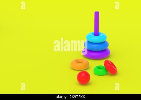 Toy pyramid tower on yellow background. Children education. Educational ...