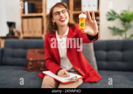Young caucasian woman psychologist prescribe pills treatment at ...