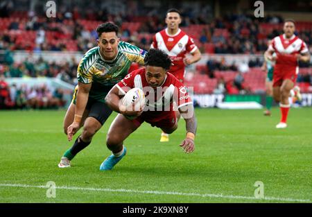 Tonga's Tesi Niu goes over the line to score a try during the Rugby ...