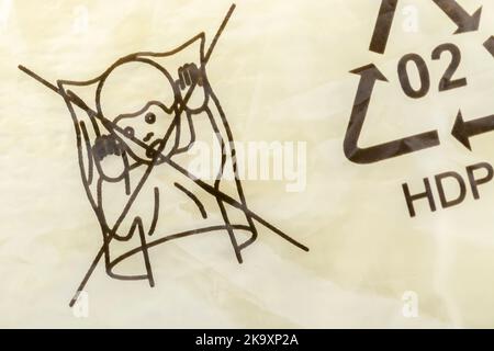 Plastic packaging symbols: warning to keep bags away from children, recycle icon, recyclable ...