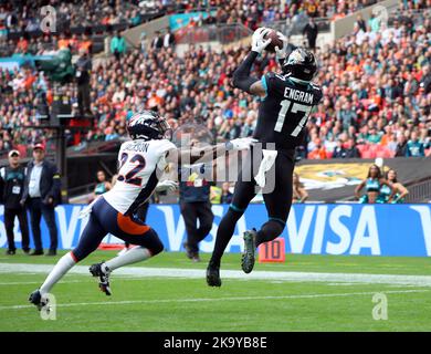 Denver Broncos tight end Evan Engram (1) kneels on the field before an ...