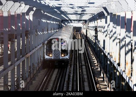 Subway cars crossing the Williamsburg Bridge between Brooklyn and Manhattan in New York City ...