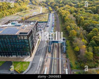 Aerial view over Kirkstall Forge Train Station, Leeds, with car park ...