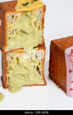 Sliced puff pastry cube shaped croissant with berry custard cream ...