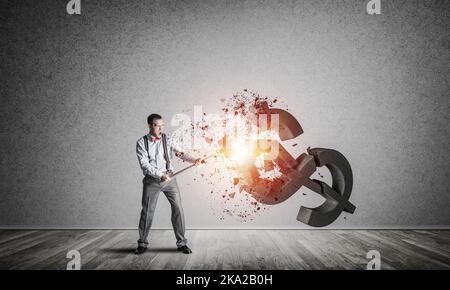 Determined banker man in empty concrete room breaking dollar figure ...