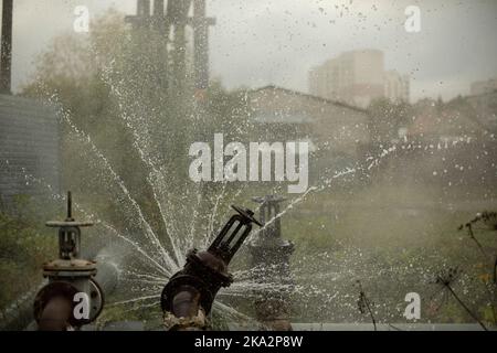 Pipeline accident. Water pours out of pipe. Emergency Stock Photo - Alamy