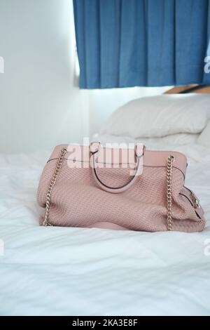 women purse wallet on bed, close up Stock Photo - Alamy