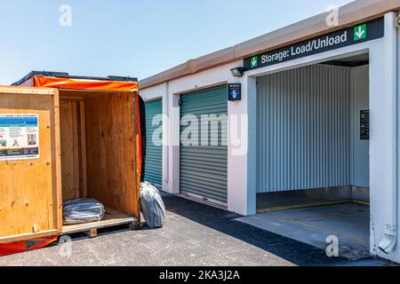 Ft Myers, USA - May 16, 2022: Man male person locking closing door of U ...