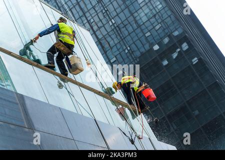 Chongqing, China-July 20th, 2021: chinese worker cleaning windows ...