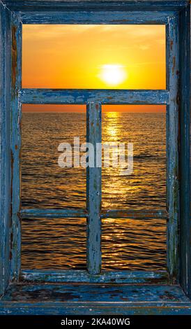 old window frame with remnants of blue paint with a beautiful autumn ...
