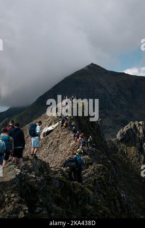 Hikers on Crib Goch knife edge ridge top scramble at start of Mount ...