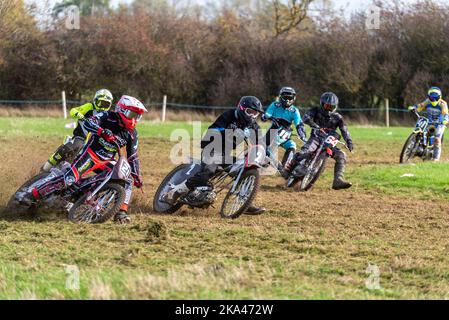 Riders racing in grasstrack motorcycle race. Donut Meeting event ...