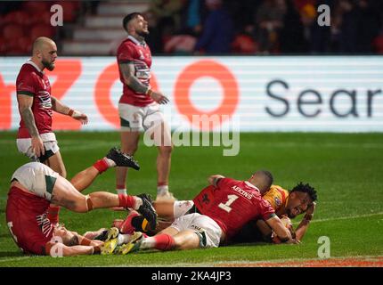 Papua New Guinea's Nixon Putt (right) celebrates scoring their side's ...