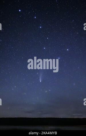 A vertical shot of the blue sky with a shooting star Stock Photo - Alamy