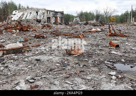 IZIUM, UKRAINE - OCTOBER 31, 2022 - An investigator takes photos of the ...