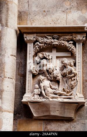 Romanesque bas-relief crucifixion scene with pink marble Doric columns ...