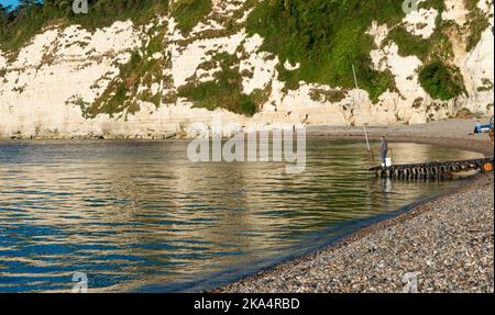 Beer Beach Devon. Fishing from the Jetty Stock Photo - Alamy