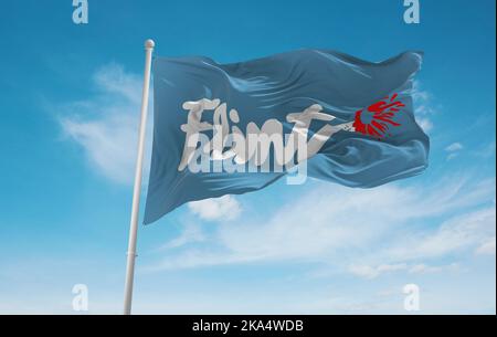official flag of Flint, Michigan untied states of America at cloudy sky ...