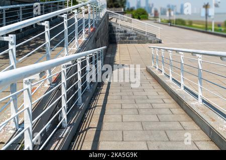 A wheelchair ramp, an inclined plane installed in addition to or ...