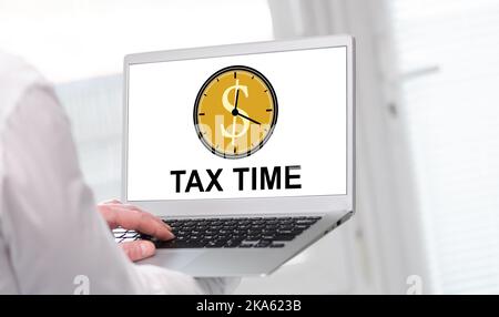 Laptop screen displaying a tax time concept Stock Photo - Alamy