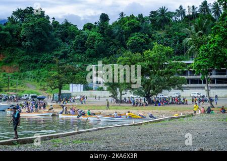 Locals gathering around harbour foreshore. Alotau, Milne Bay Papua New ...