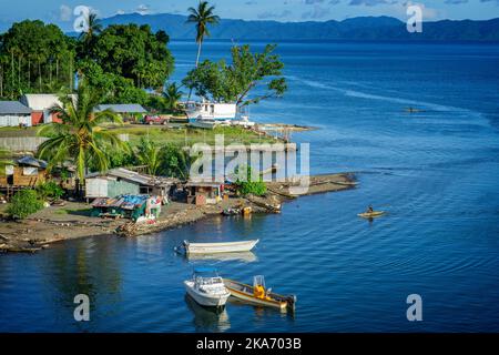 Fishing village set on foreshore of Milne Bay, Alotau, Papua New Guinea ...