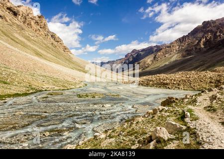 The Zanskar river flows through the high Himalayan mountains on a ...
