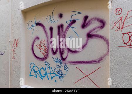 Ugly graffiti scrawled over walls in Roberts Ope an old alleyway in ...