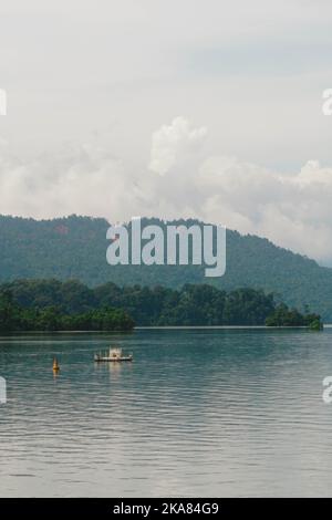 A photo in the vast Tasik Kenyir Lake in Terengganu, Malaysia which ...