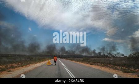 Bushfire on the Road western australia Exmouth Stock Photo - Alamy