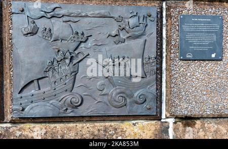 Heritage plaque by Sue Webber on the Quay Wall at Minehead depicting ...