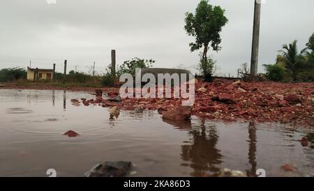 A view of a large puddle formed by rain Stock Photo - Alamy
