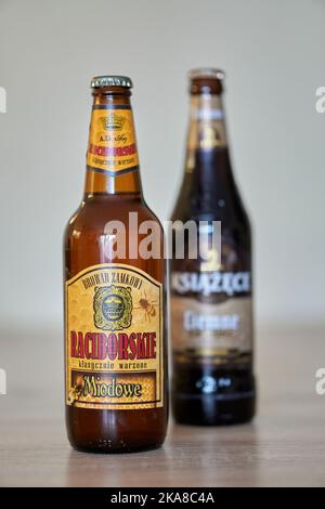 A vertical shot of the Polish Ksiazece and Raciborskie beer bottles on ...