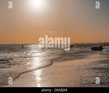 Mesmerizing view of a sandy beach during a beautiful sunset Stock Photo ...
