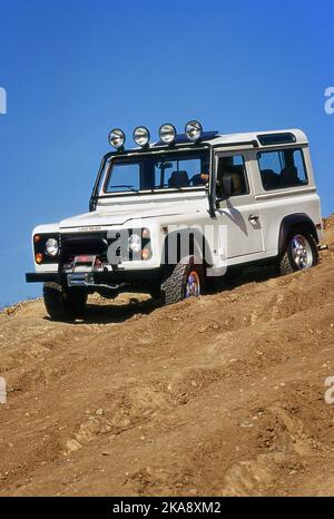 Land Rover Defender 90 V8 driving off road in Scotland UK Stock Photo ...