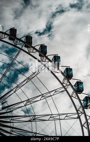 Temporary Ferris Wheel with cloudy sky in Stuttgart Stock Photo - Alamy