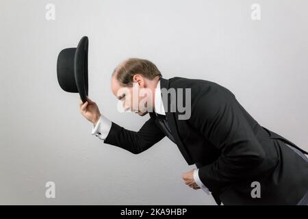 A British businessman bowing Stock Photo - Alamy