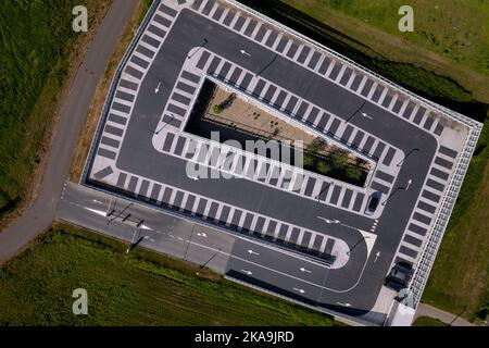 Slanted top down aerial view with a single car parked in graphic ...