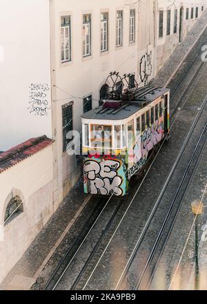 A vertical shot of a traditional tram in the city of Lisbon, Portugal ...