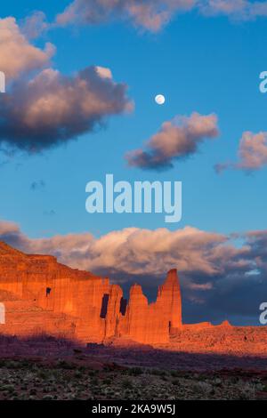 Rising moon over the Fisher Towers, eroded Cutler sandstone rock ...
