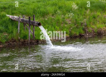 Discharge of polluted water through a pipe, toxic, polluted Stock Photo ...