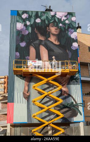 Artist Zane Prater paints a mural during Asalto International Urban Art ...