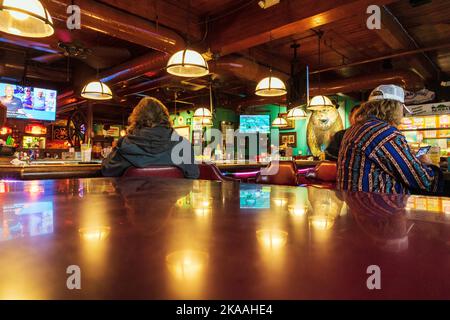 Fisherman eat & drink at Henry's Great Alaskan Restaurant; Kodiak ...