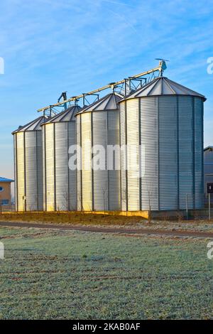 silos in the middle of a field in wintertime Stock Photo - Alamy