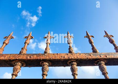 rotten old rusty fence under blue sky Stock Photo - Alamy