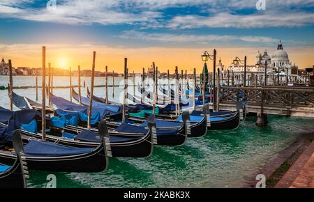 gondolas moored in Venice at sunset Stock Photo - Alamy