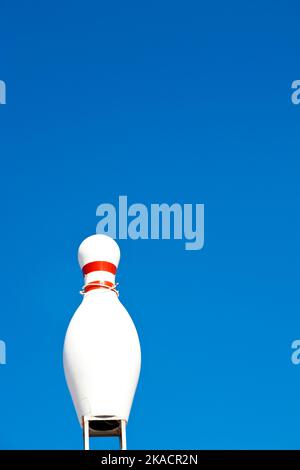 bowling pin in blue sky as symbol for a bowling place Stock Photo - Alamy