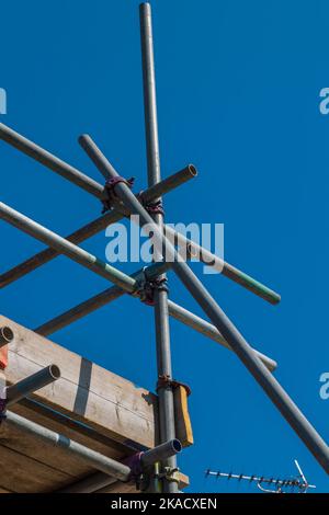 Scaffolding poles on a domestic property Stock Photo - Alamy